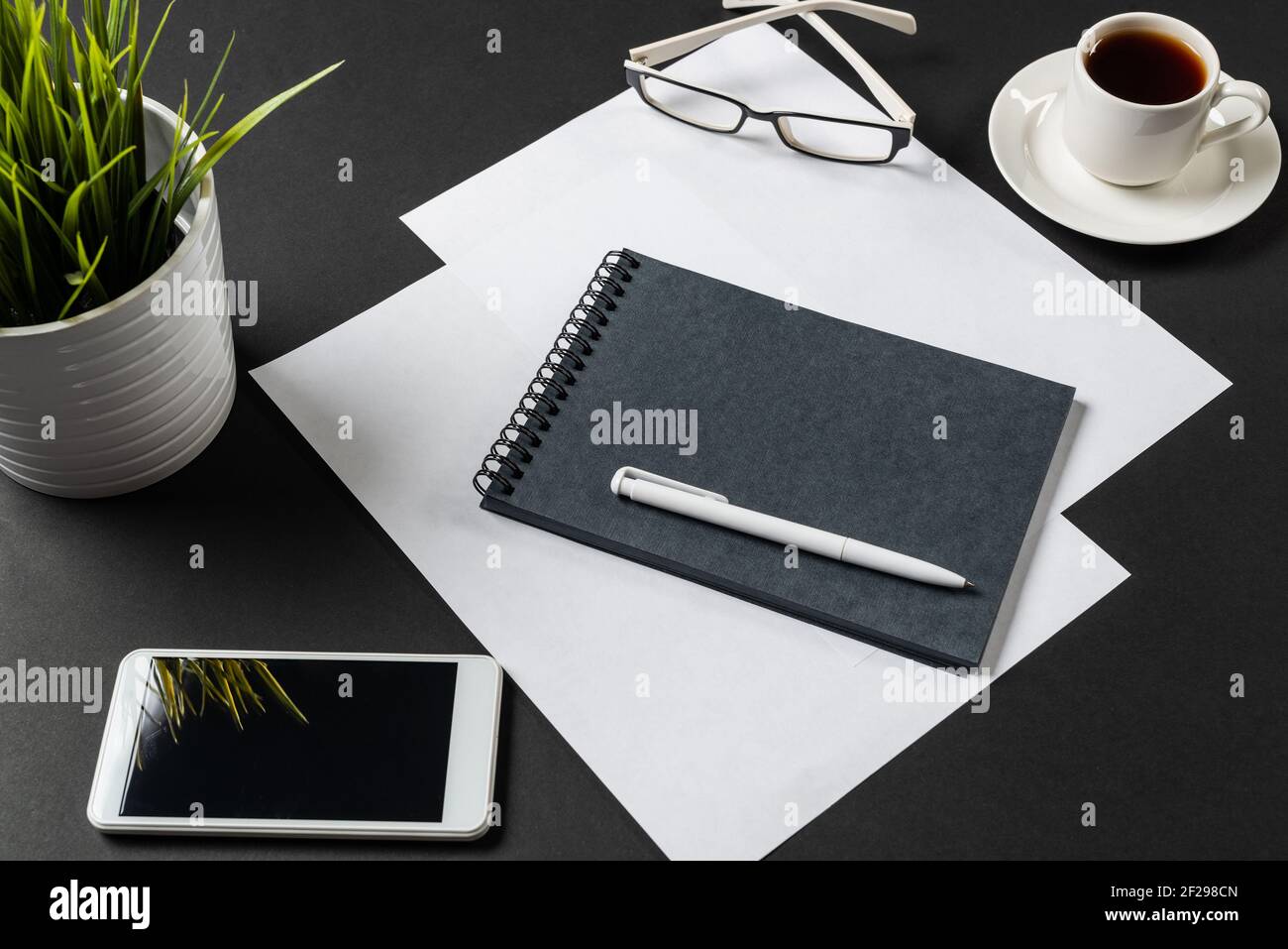 Top view of modern workplace with notepad Stock Photo - Alamy