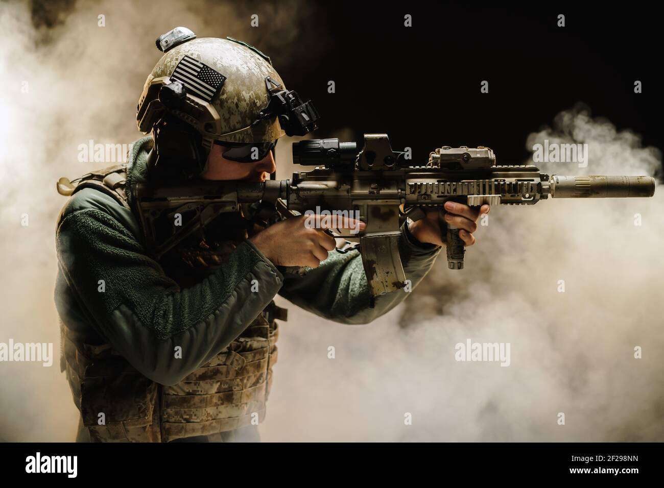 Special forces soldier aiming with his rifle in fog Stock Photo - Alamy
