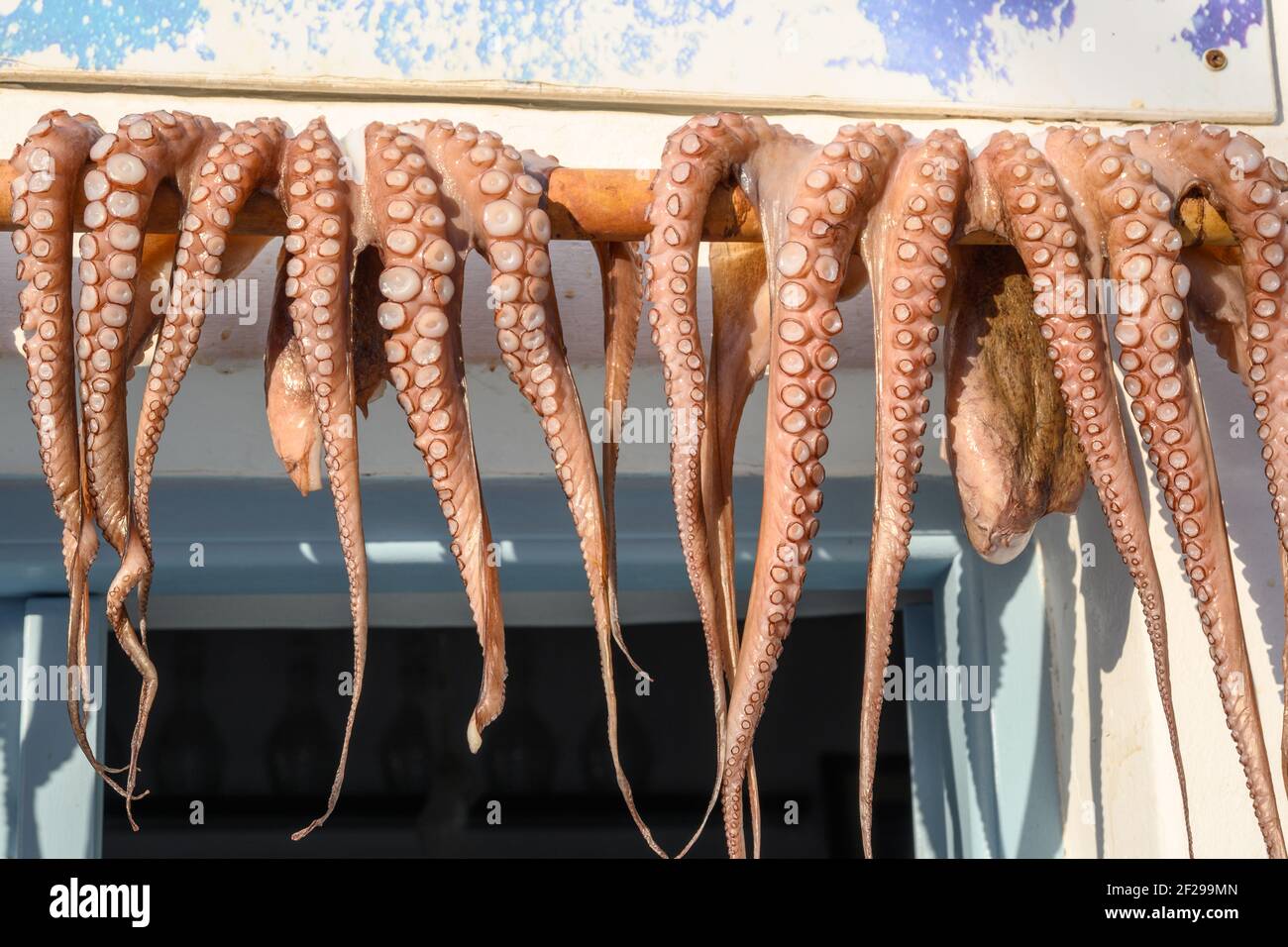 Drying octopus on the street in Naoussa village. Paros Island, Cyclades ...