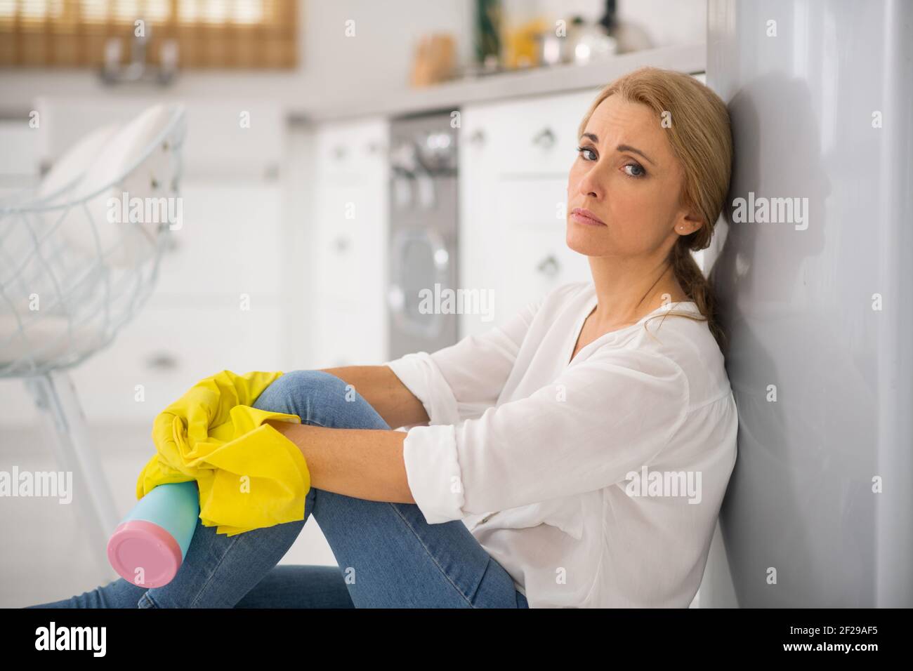 Tired housewife sitting on hi-res stock photography and images - Alamy