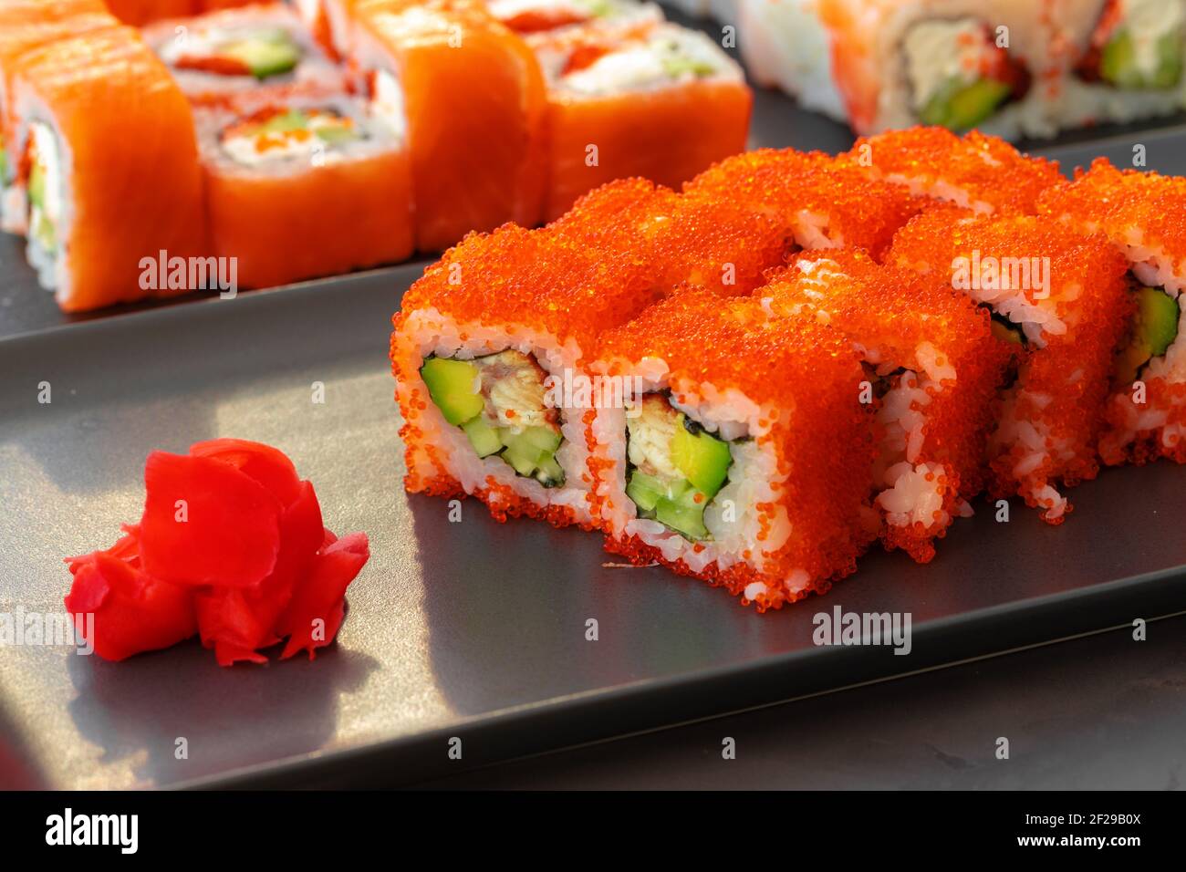 Set of various sushi rolls served on gray background Stock Photo - Alamy