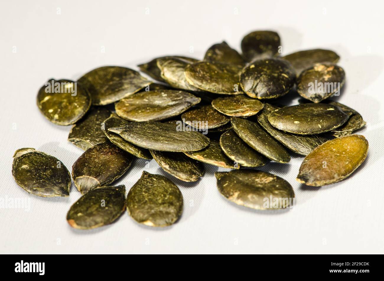 group of pumpkin seeds isolated Stock Photo - Alamy