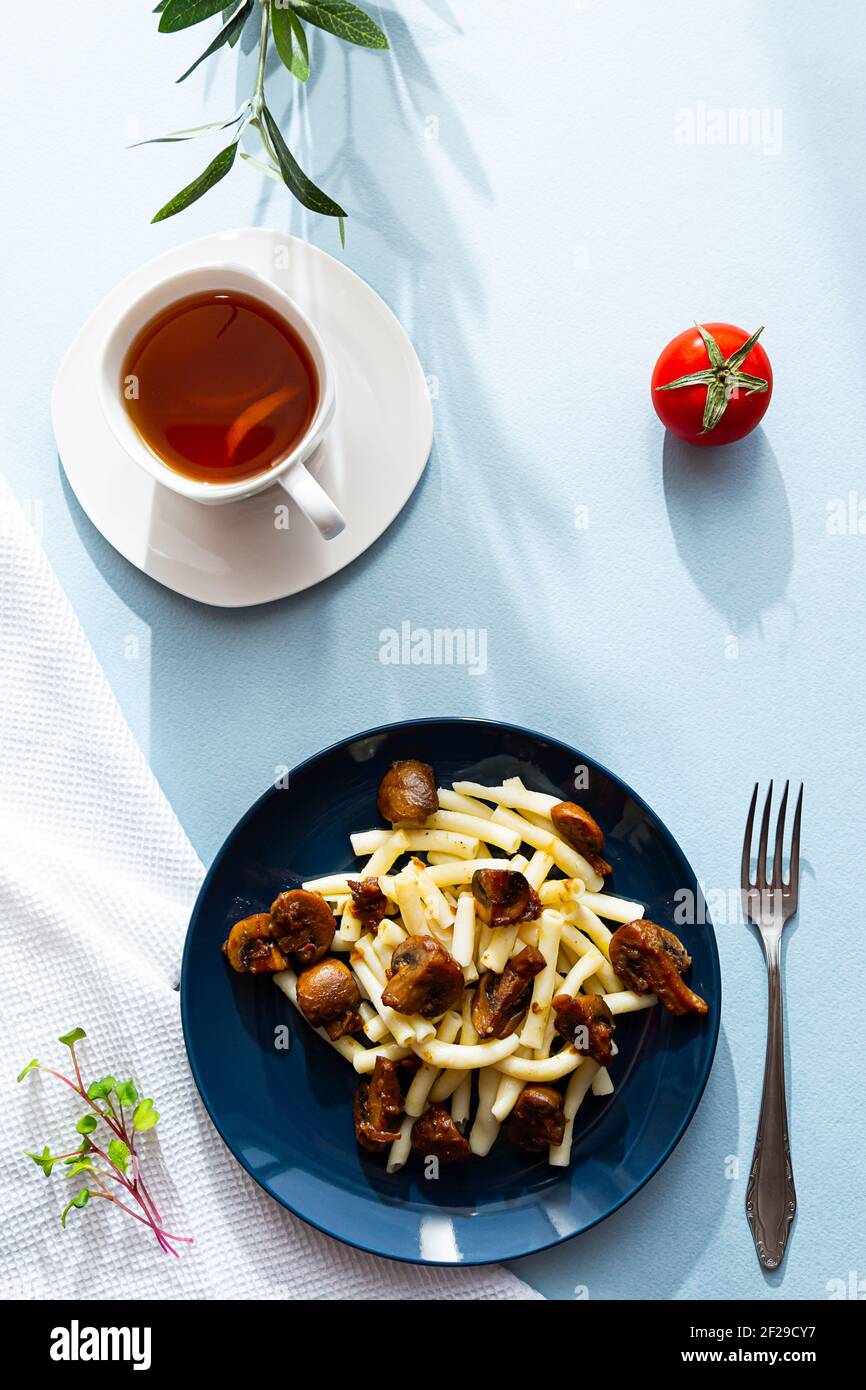 Homemade veggie pasta with fried mushrooms. Healthy breakfast modern ...