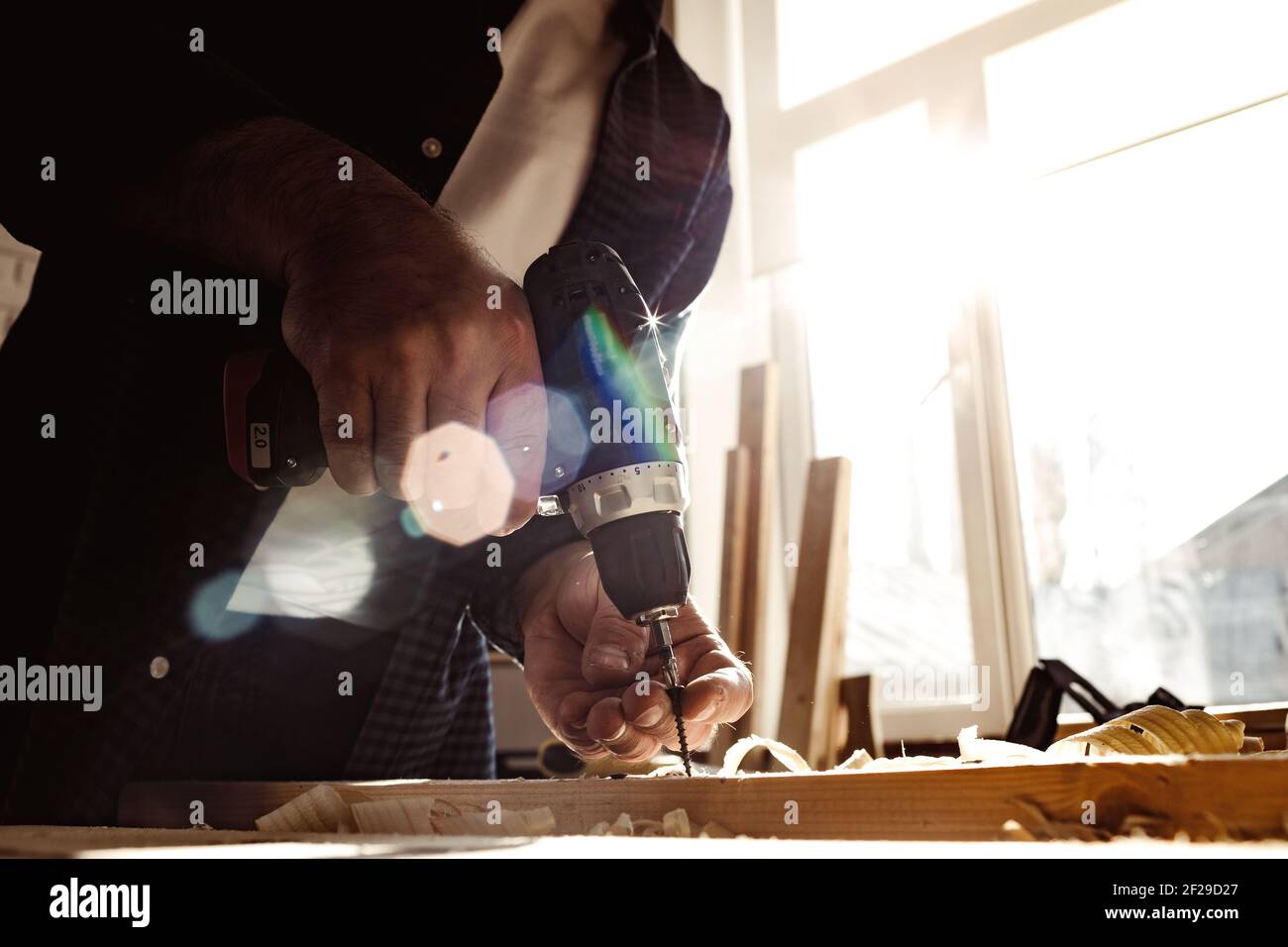 Close up of a carpenter drilling a hole in timber Stock Photo - Alamy