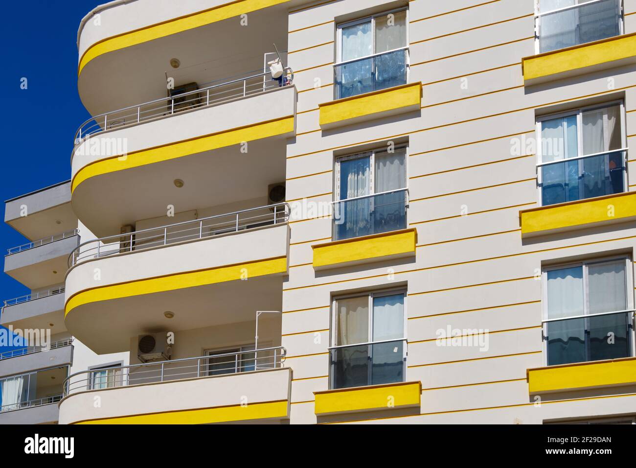 Yellow color decorated multi storey residential building Stock Photo ...
