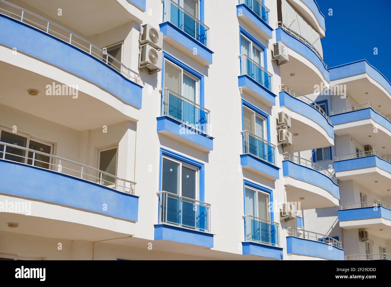 Blue and white multi storey residential building. Modern apartment ...