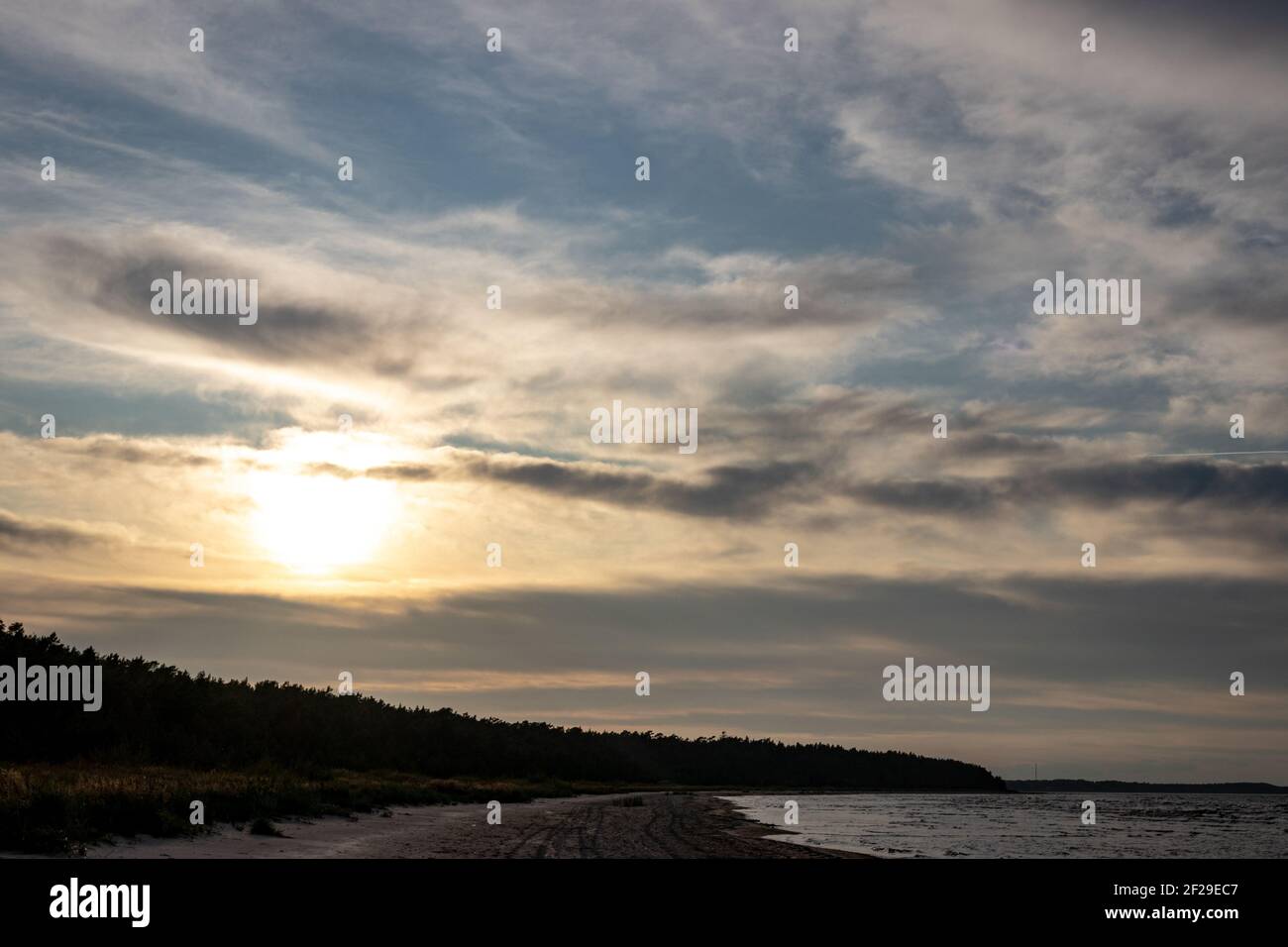 Amazing beauty sunset on Baltic sea on blue sky with white clouds ...