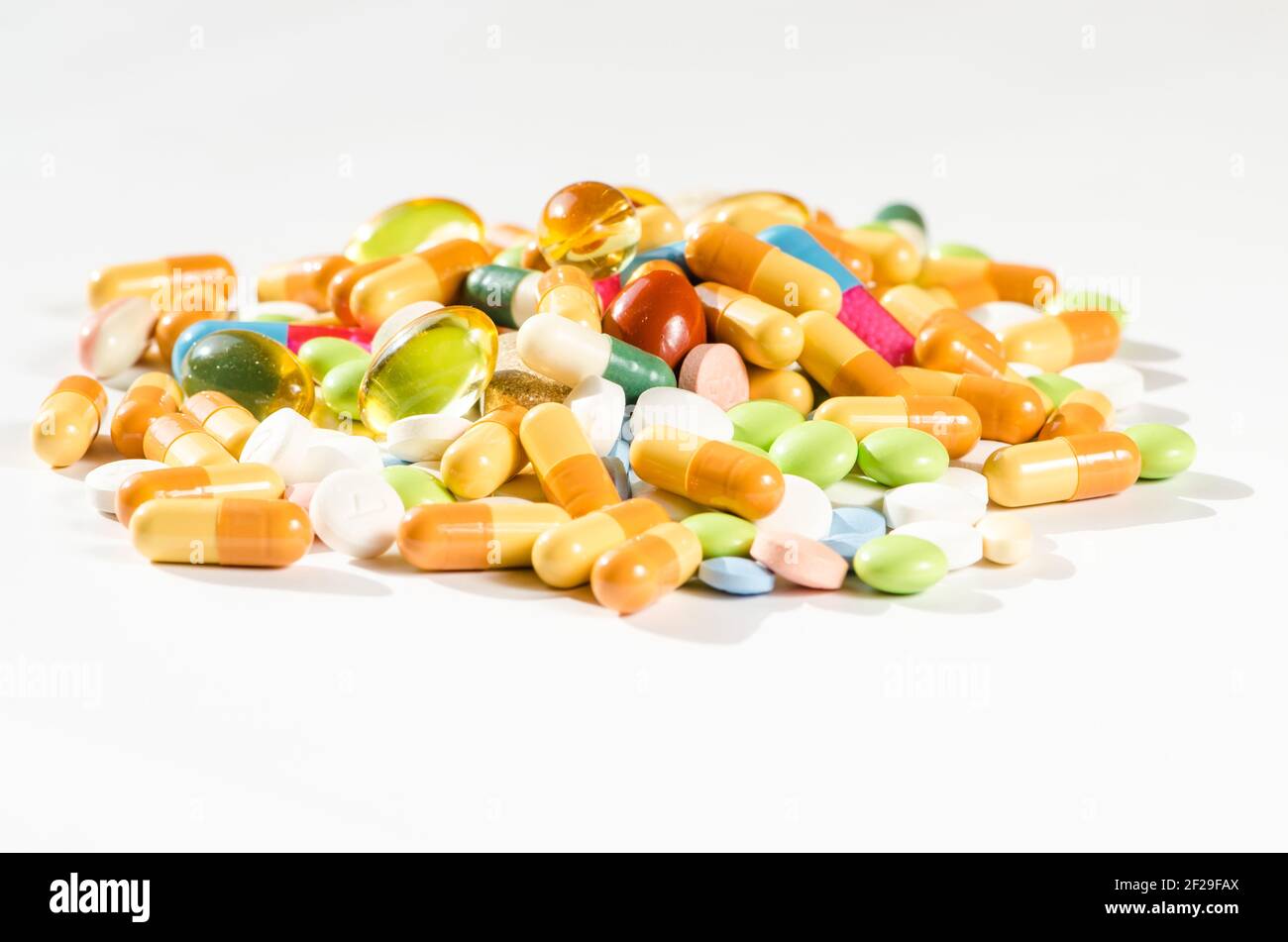 different colorful pills background image Stock Photo - Alamy