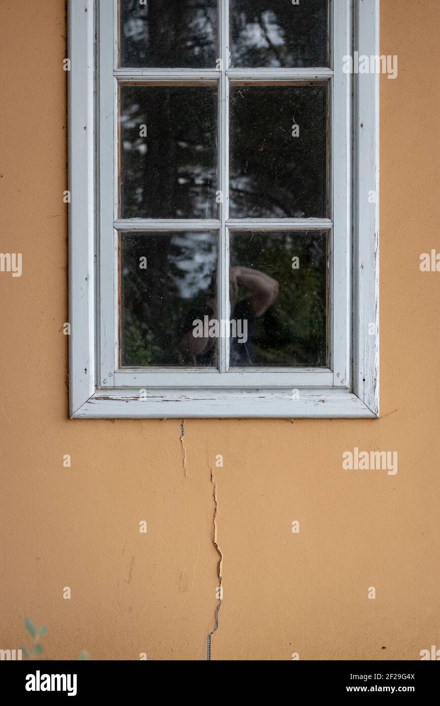 Yellow outdoor wall with window Stock Photo - Alamy