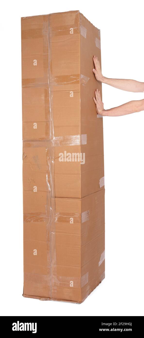 Man pushing a oversized cardboard box, isolated on white Stock Photo ...