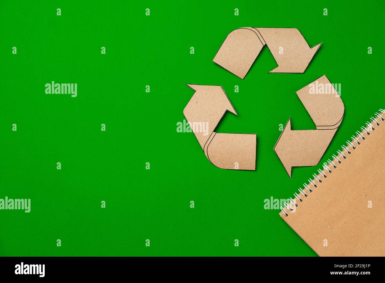 Paper recycling concept on green background top view Stock Photo - Alamy