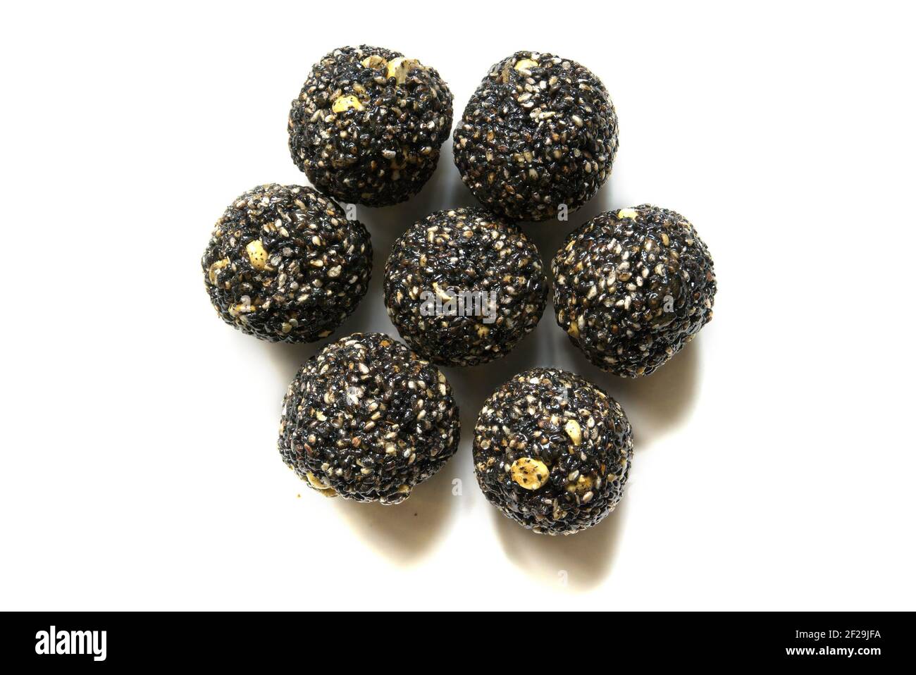 Indian sweet sesame seeds ladoo, known as Ellunda in Kerala, isolated ...