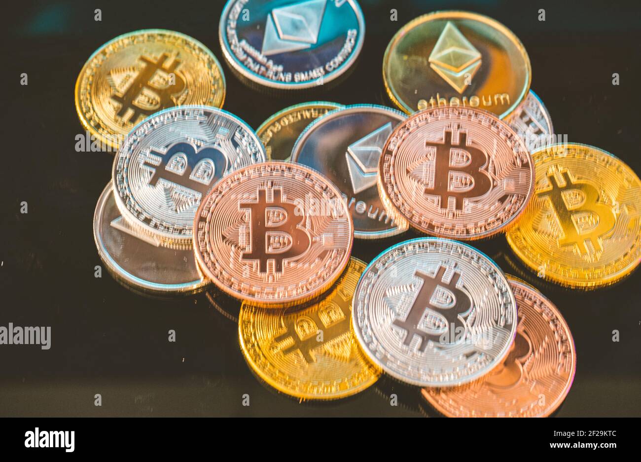 Money, Bitcoin gold, silver and copper coins and defocused printed ...