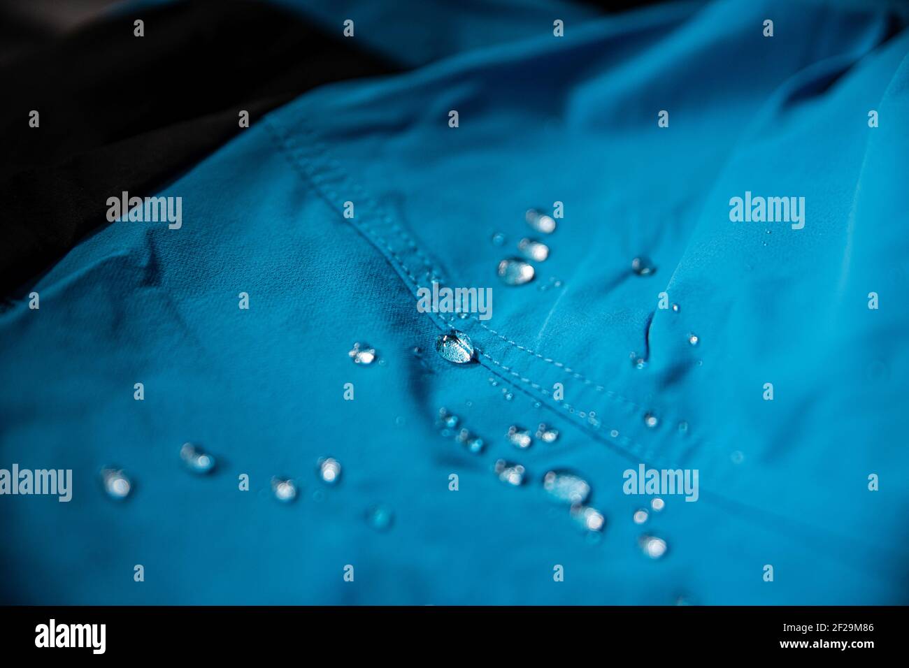 Hydrophobic effect on blue waterproof fabric Stock Photo - Alamy