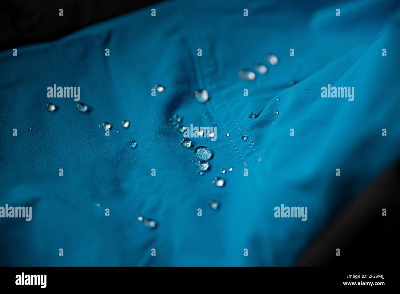 Hydrophobic effect on blue waterproof fabric Stock Photo - Alamy