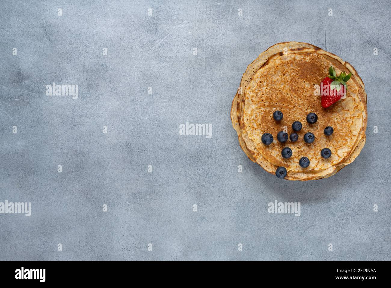 Tasty homemade rustic pancake on concrete background. Table top view ...