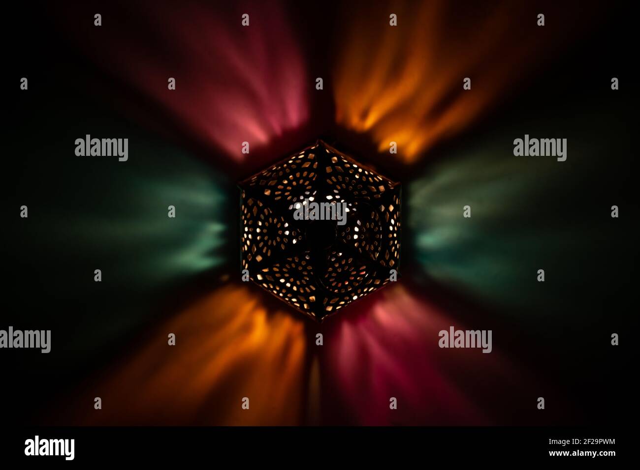 Top view of a steel lamp with colorful stained glass light projections ...