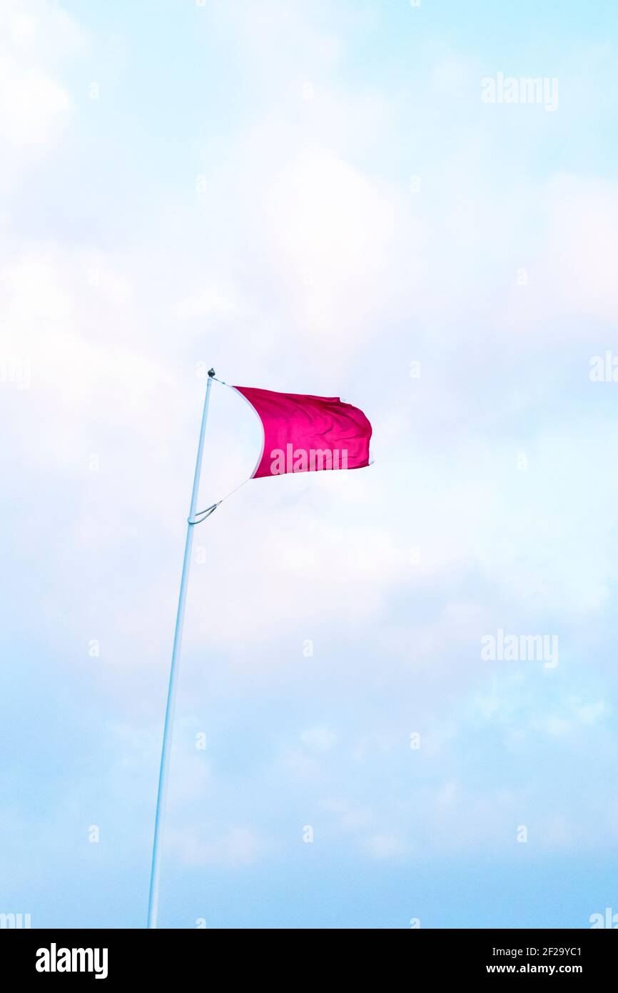 Red Danger Flag Blowing in Gale Force Winds with Strength of Wind ...