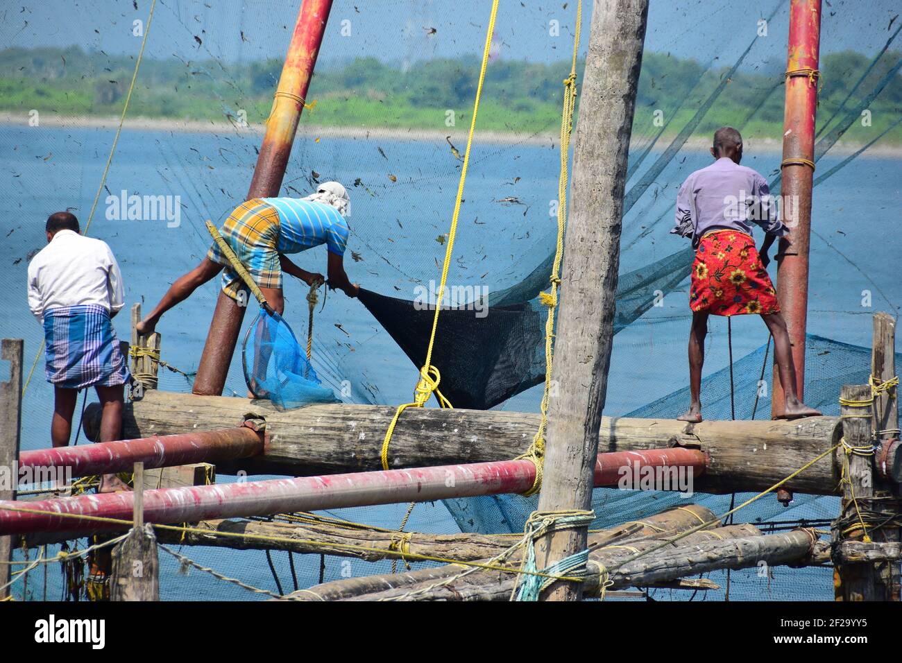 Indian Fishermen, Chinese Fishing Nets, Kochi, Cochin, Kerala, India ...