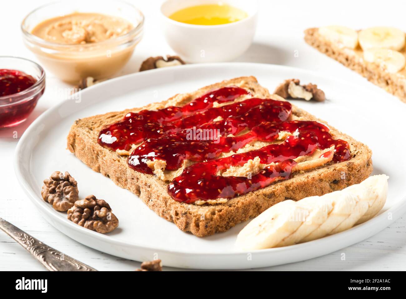 Homemade peanut butter sandwiches with raspberry jam and banana Stock ...