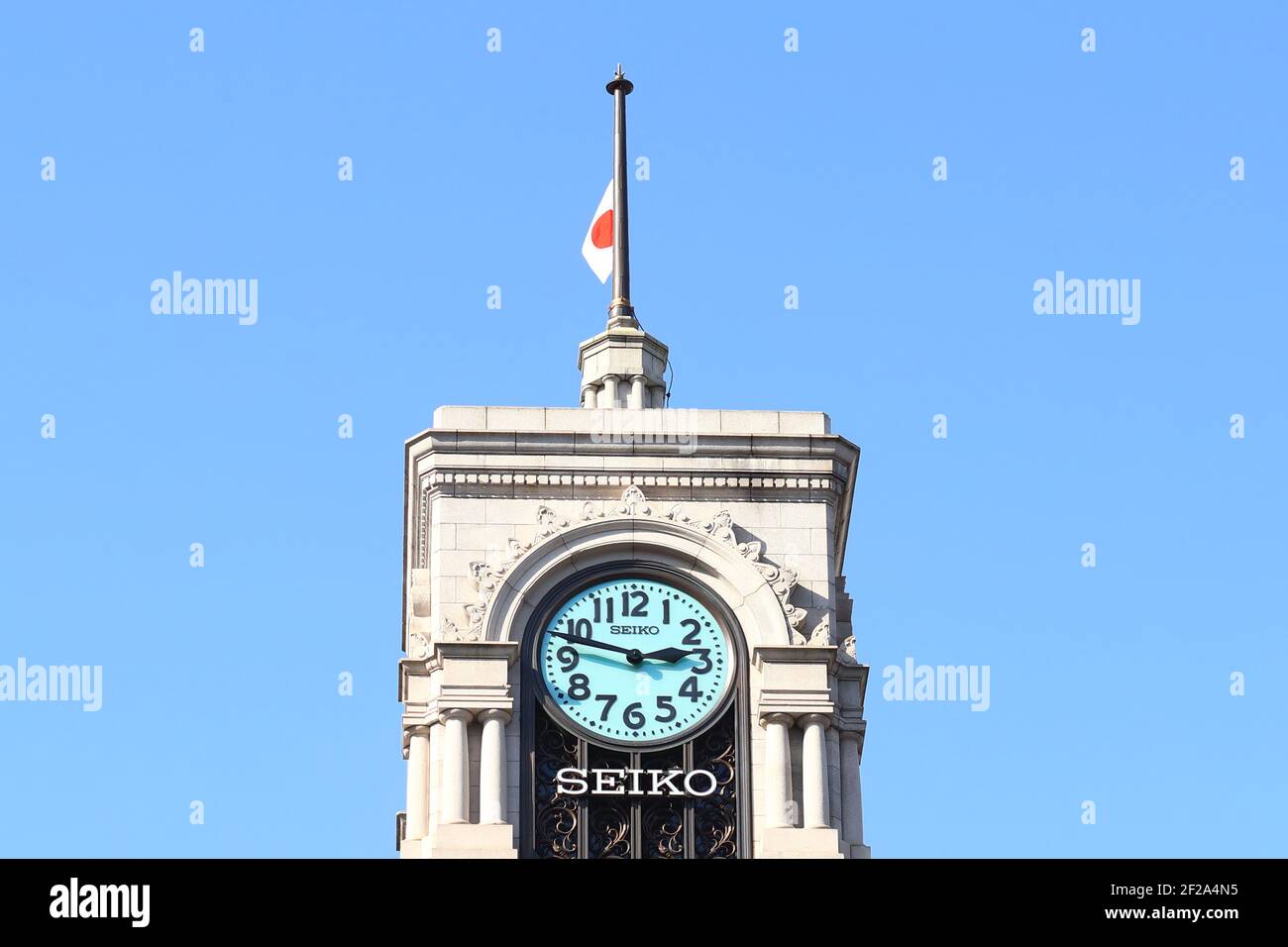Tokyo, Japan. March 11, 2021: A Japanese national flag flies at half ...