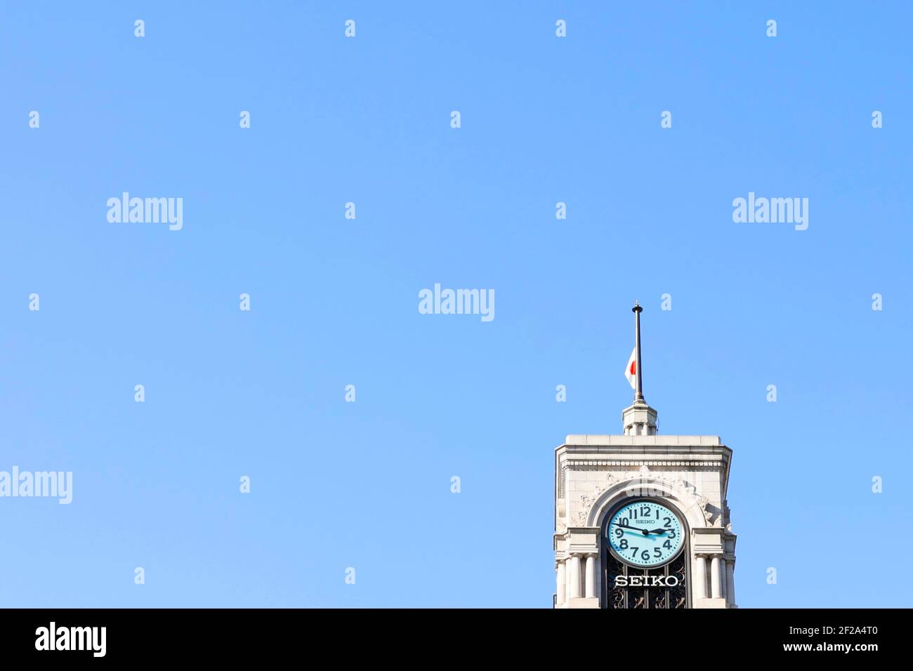 Tokyo, Japan. March 11, 2021: A Japanese national flag flies at half ...