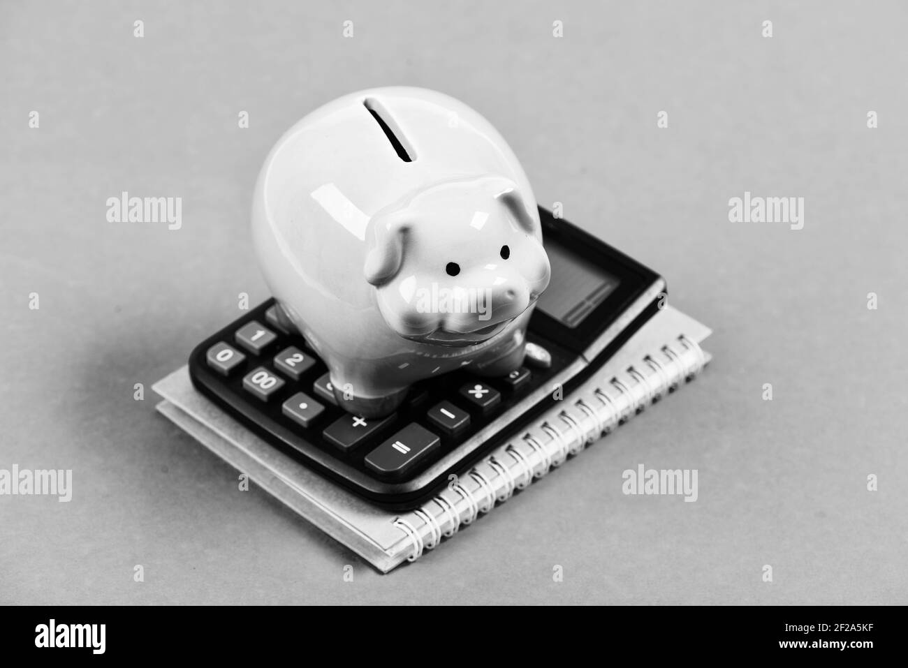 Family counting money piggy bank Black and White Stock Photos & Images ...