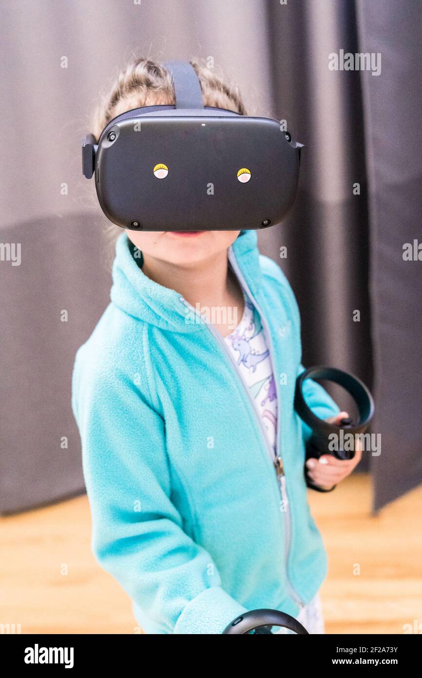 Little girl playing VR kids game in the living room Stock Photo - Alamy