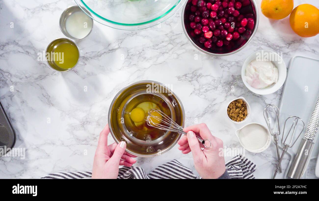 Flat lay. Step by step. Mixing ingredients in a mixing bowl to bake ...
