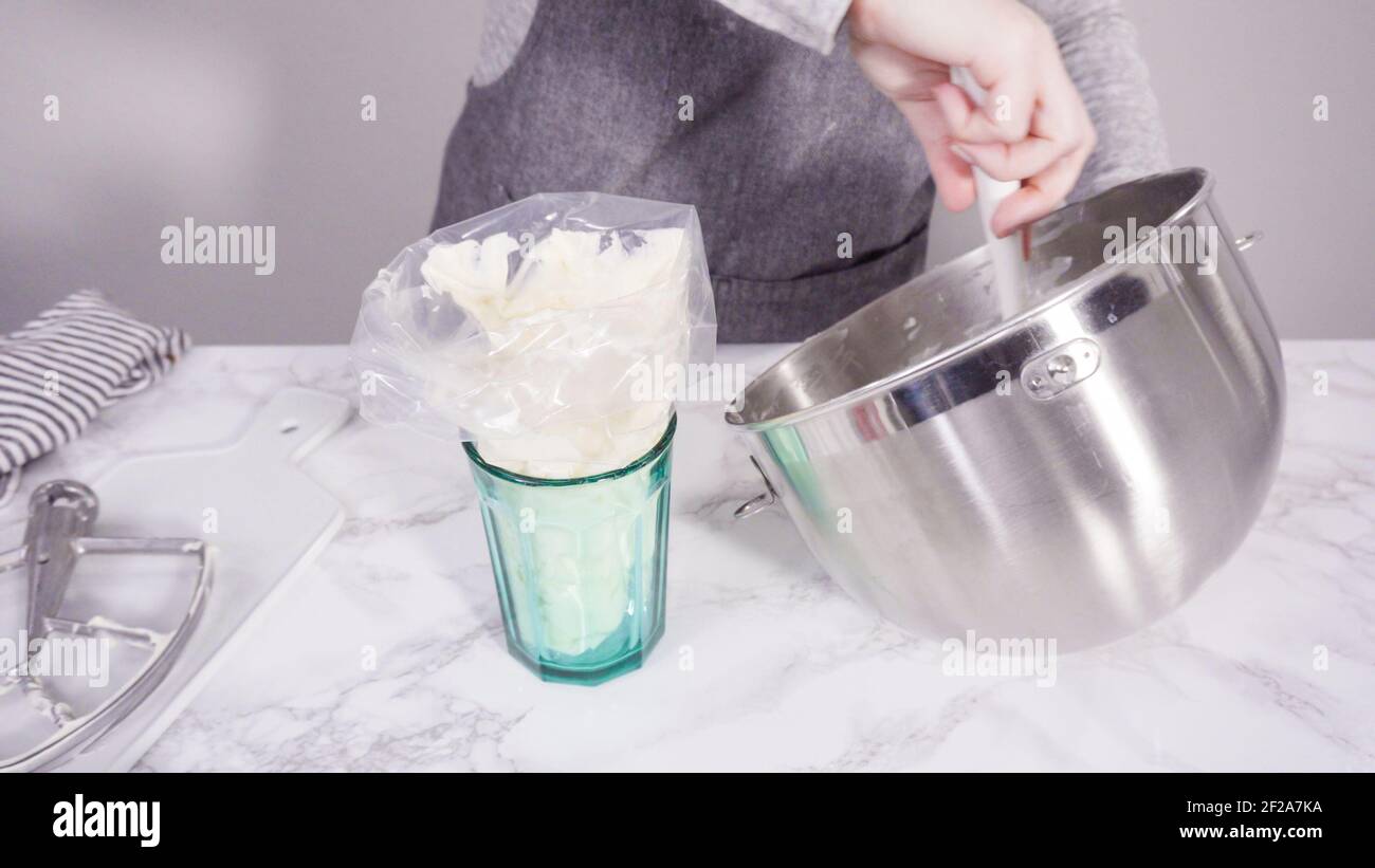 Step by step. Mixing ingredients in a standing kitchen mixer to prepare ...