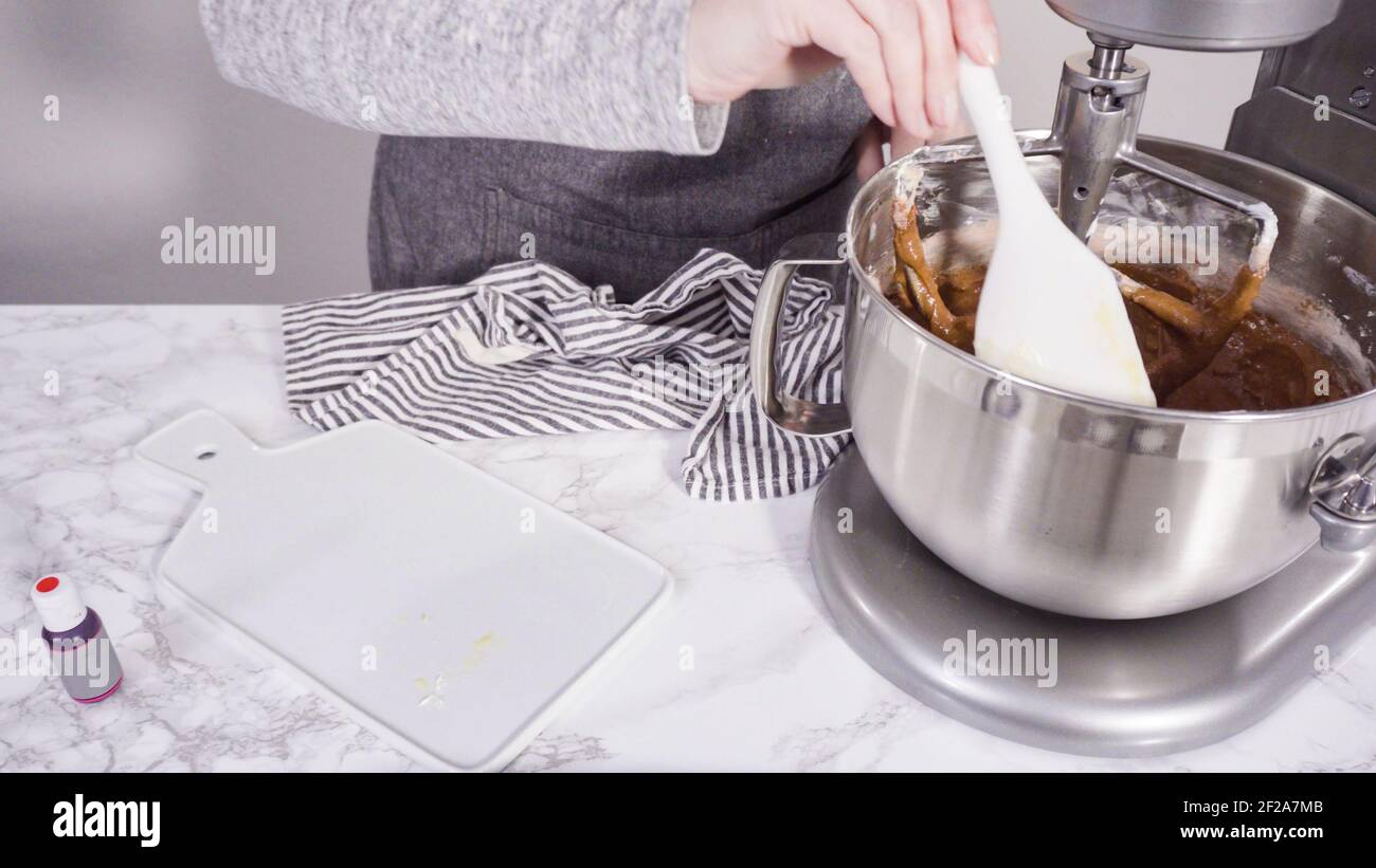 Step by step. Mixing ingredients in a standing kitchen mixer to bake ...