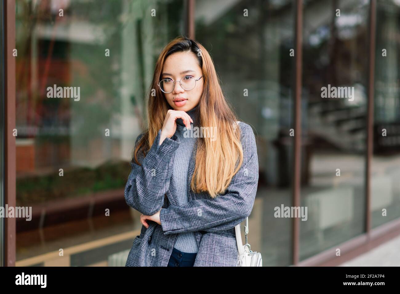 Young Asian woman, sad face portrait in city at the evening Stock Photo ...