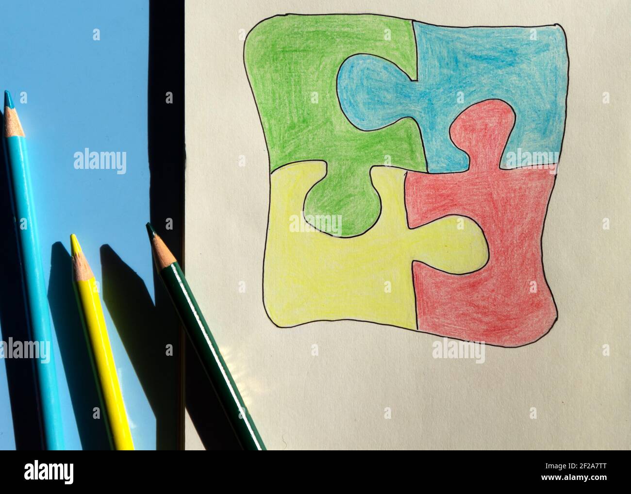 Autism awareness day or month. The drawn puzzle is colored in different ...