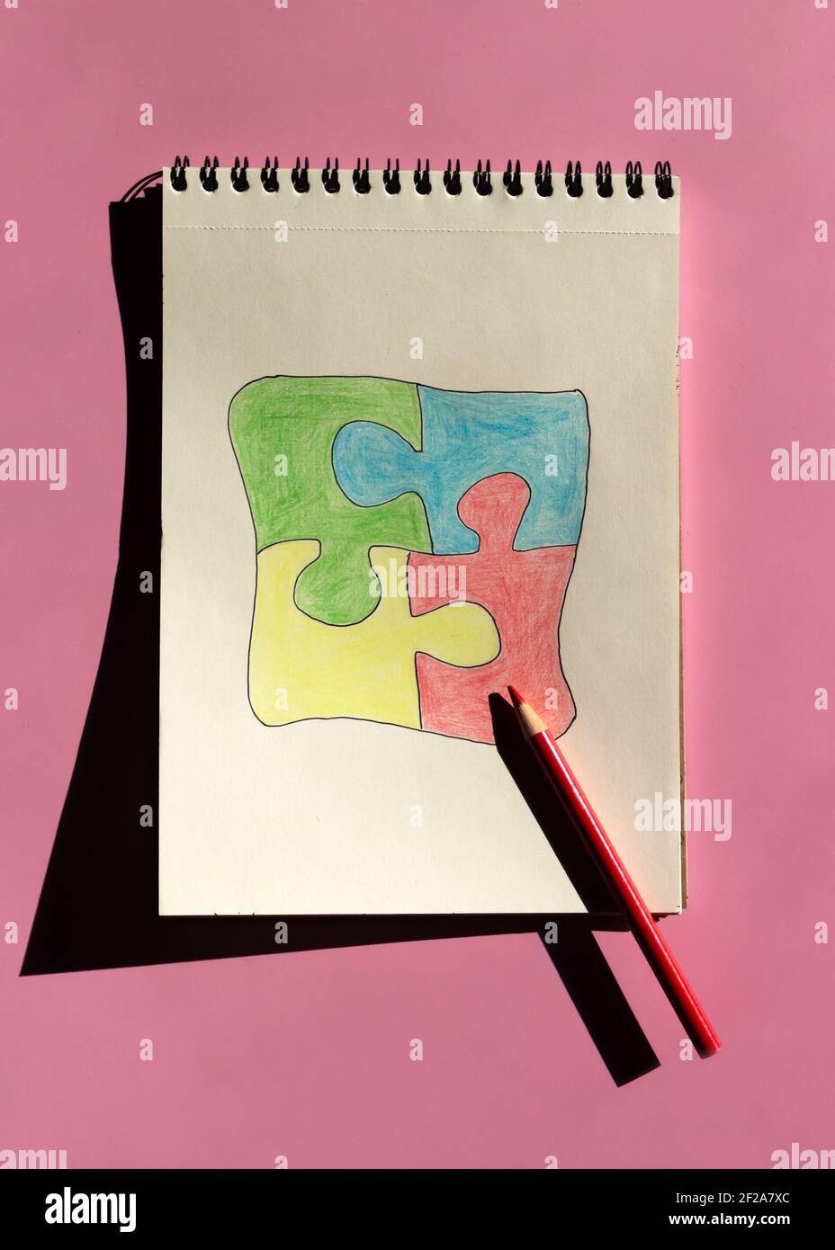 Autism awareness day or month. The drawn puzzle is colored in different ...