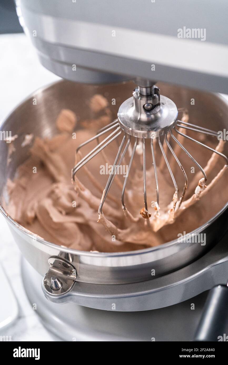 Mixing ingredients in a standing kitchen mixer to make homemade ...
