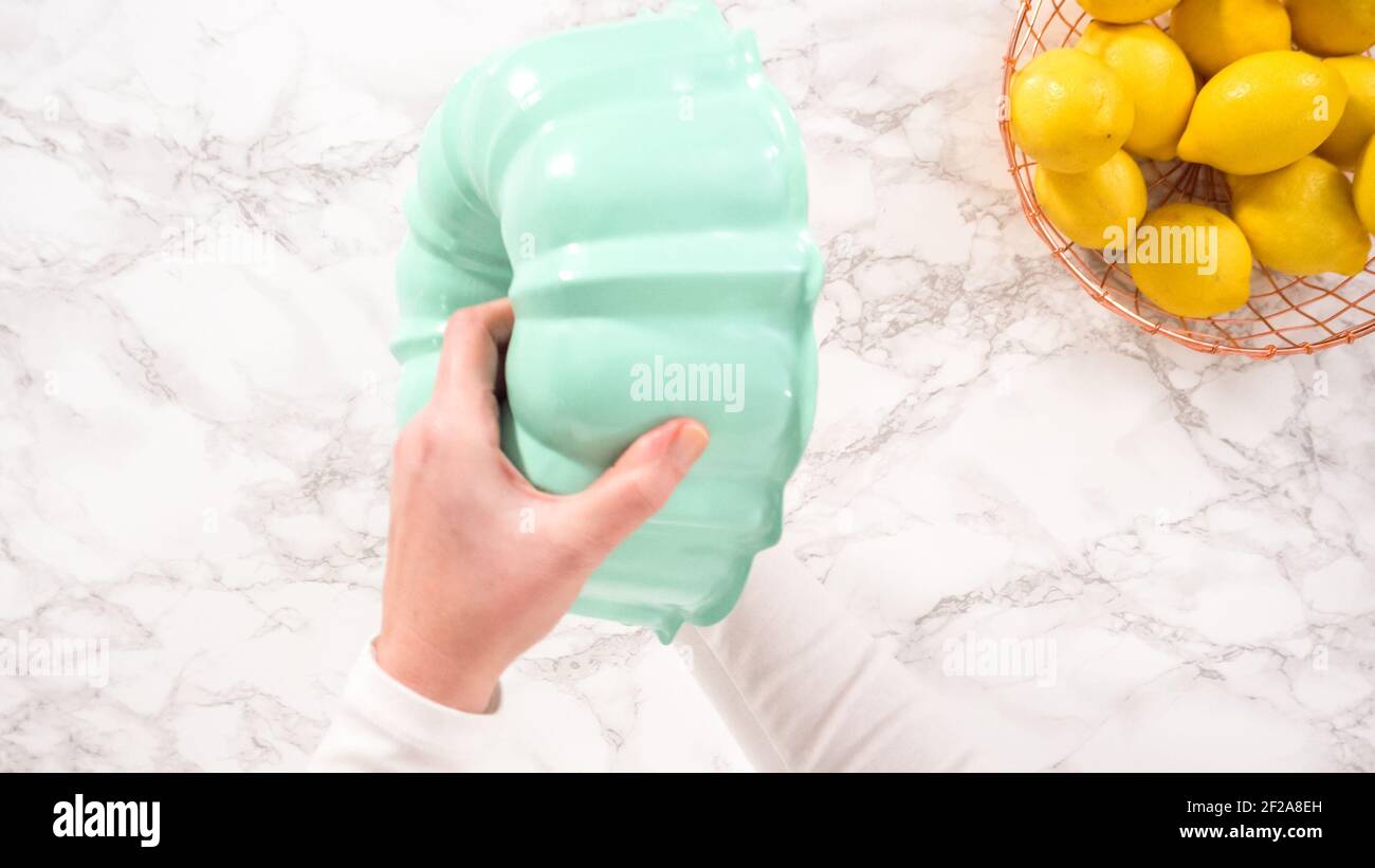 Flat lay. Step by step. Greasing bundt cake pan with vegetable ...