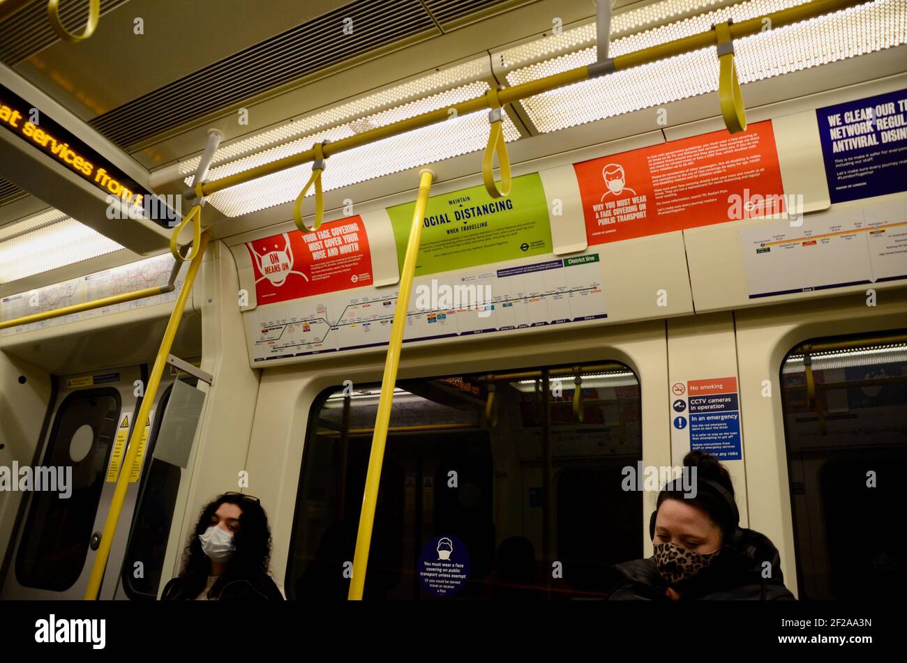 covid19 pandemic warning posters on london underground tube train Stock ...