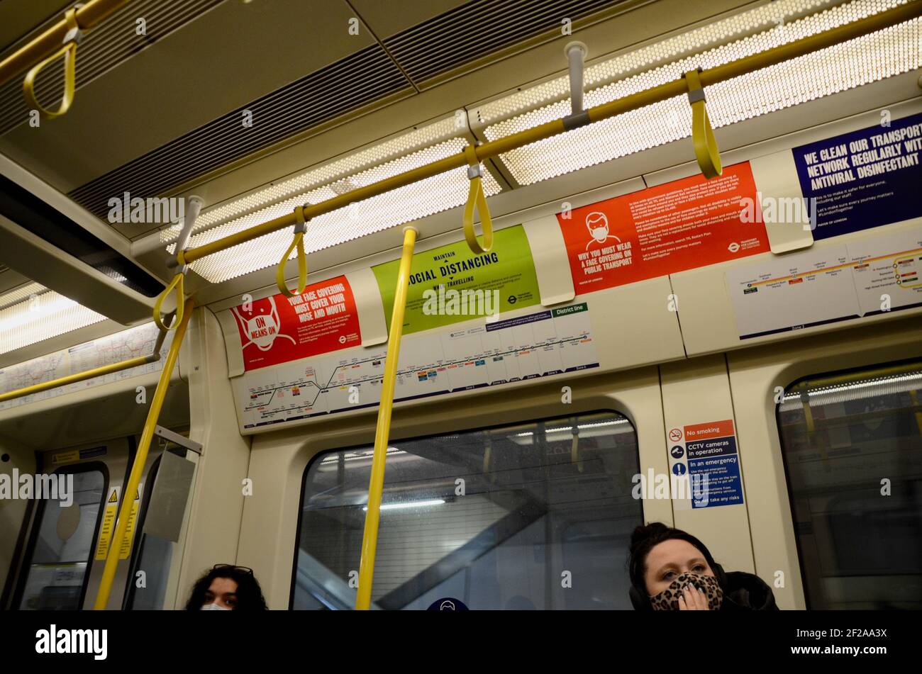 covid19 pandemic warning posters on london underground tube train Stock ...