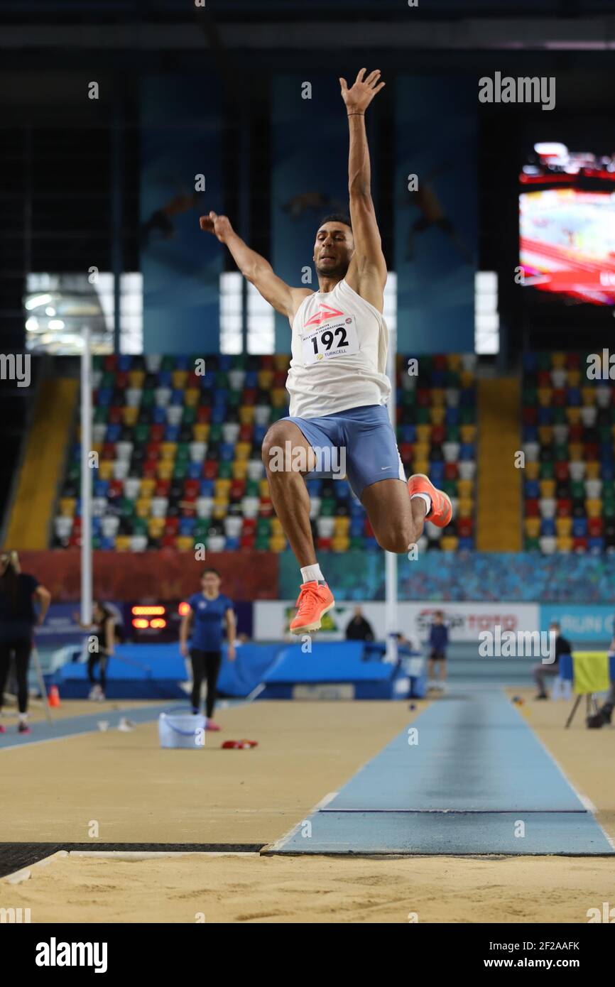ISTANBUL, TURKEY - JANUARY 30, 2021: Undefined athlete long jumping ...