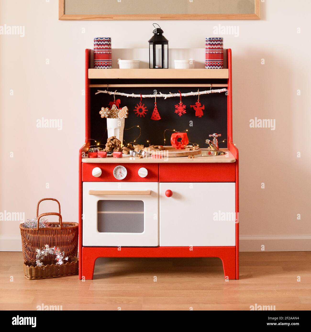 Stylish toy kitchen. Black, red and white kitchen for children ready to ...