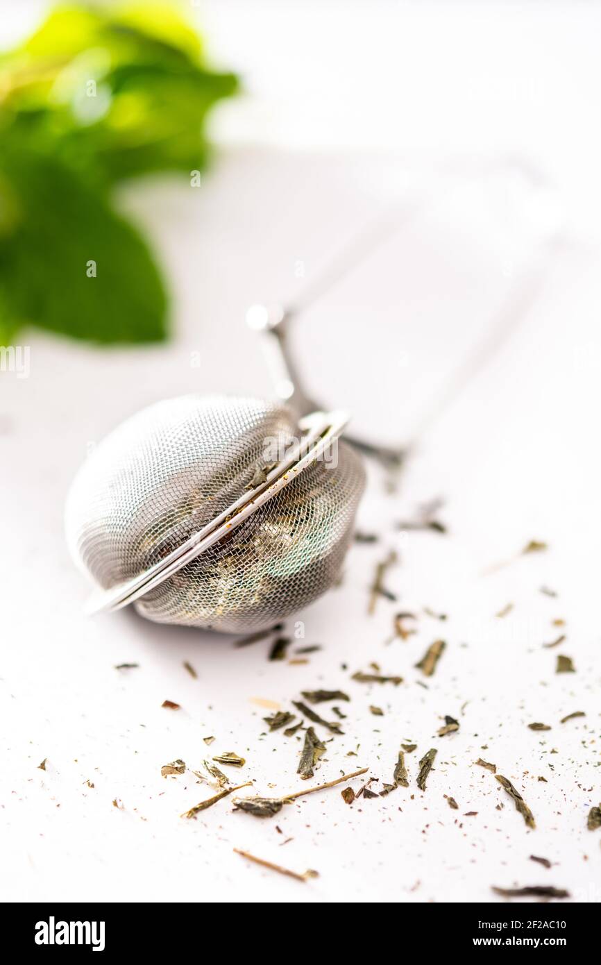 Loose leaves green tea on white background Stock Photo - Alamy