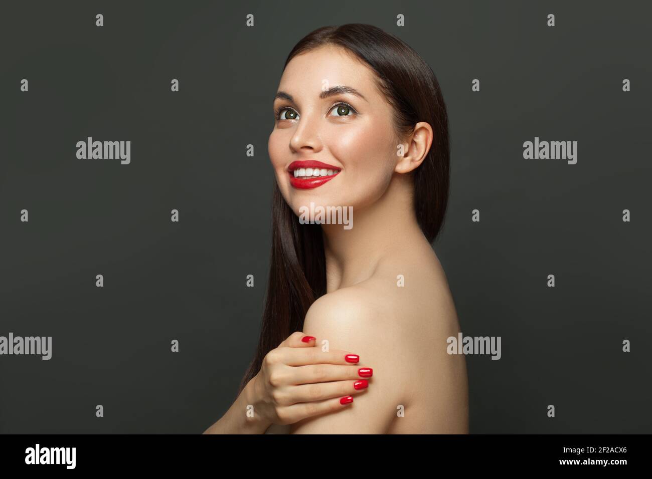 Attractive model woman with clear skin and long healthy straight hair ...