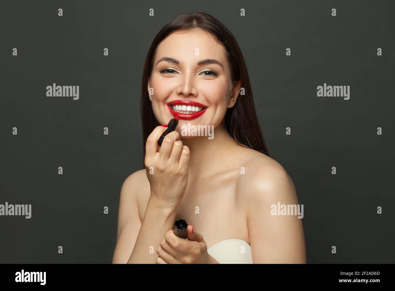 Lovely young brunette applying hi-res stock photography and images - Alamy
