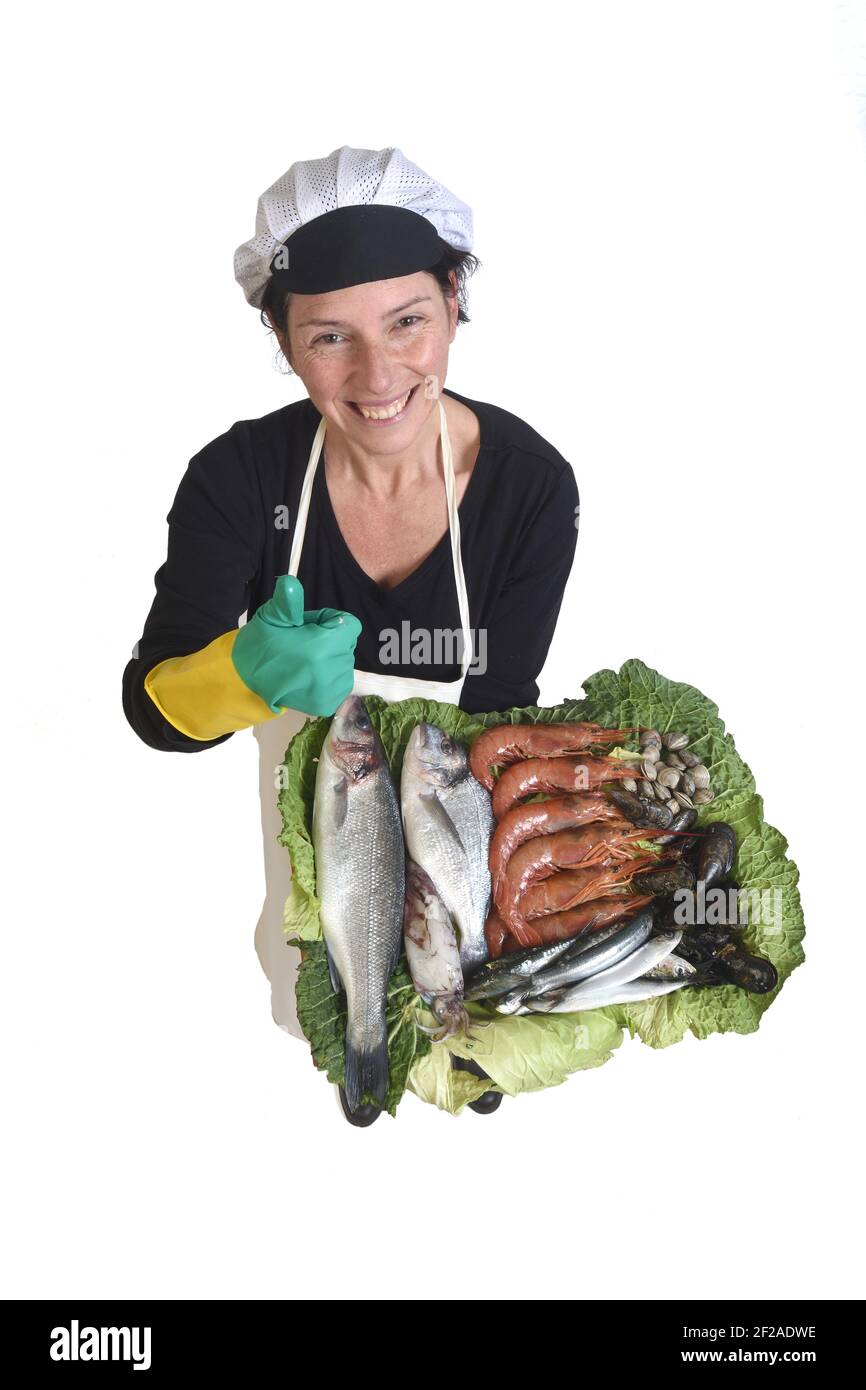 top view of fishmonger holding a dish with fish and seafood on white ...