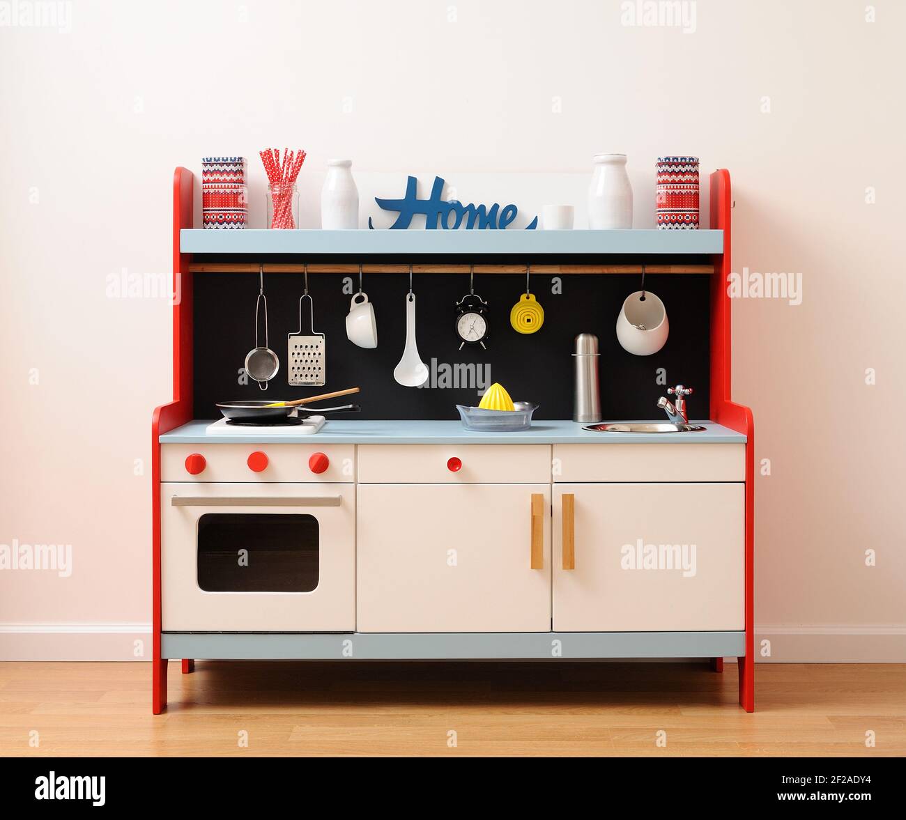 Designer toy kitchen in white, red and blue with drawers, oven, stove ...