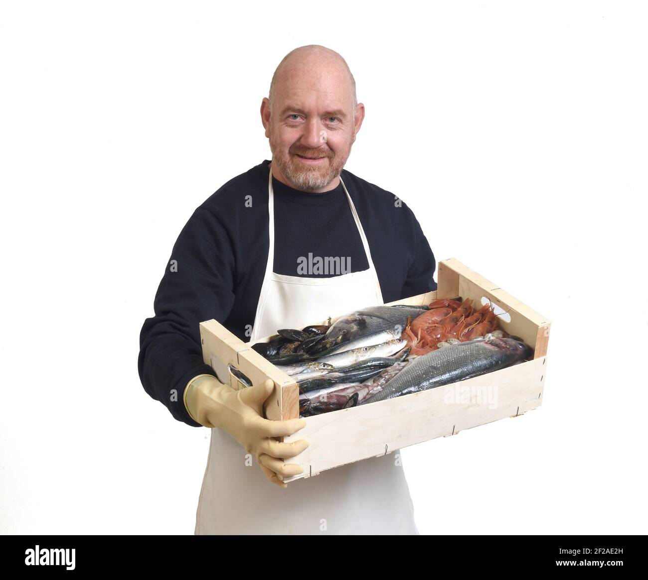 fishmonger with a box with seafood on white background Stock Photo - Alamy