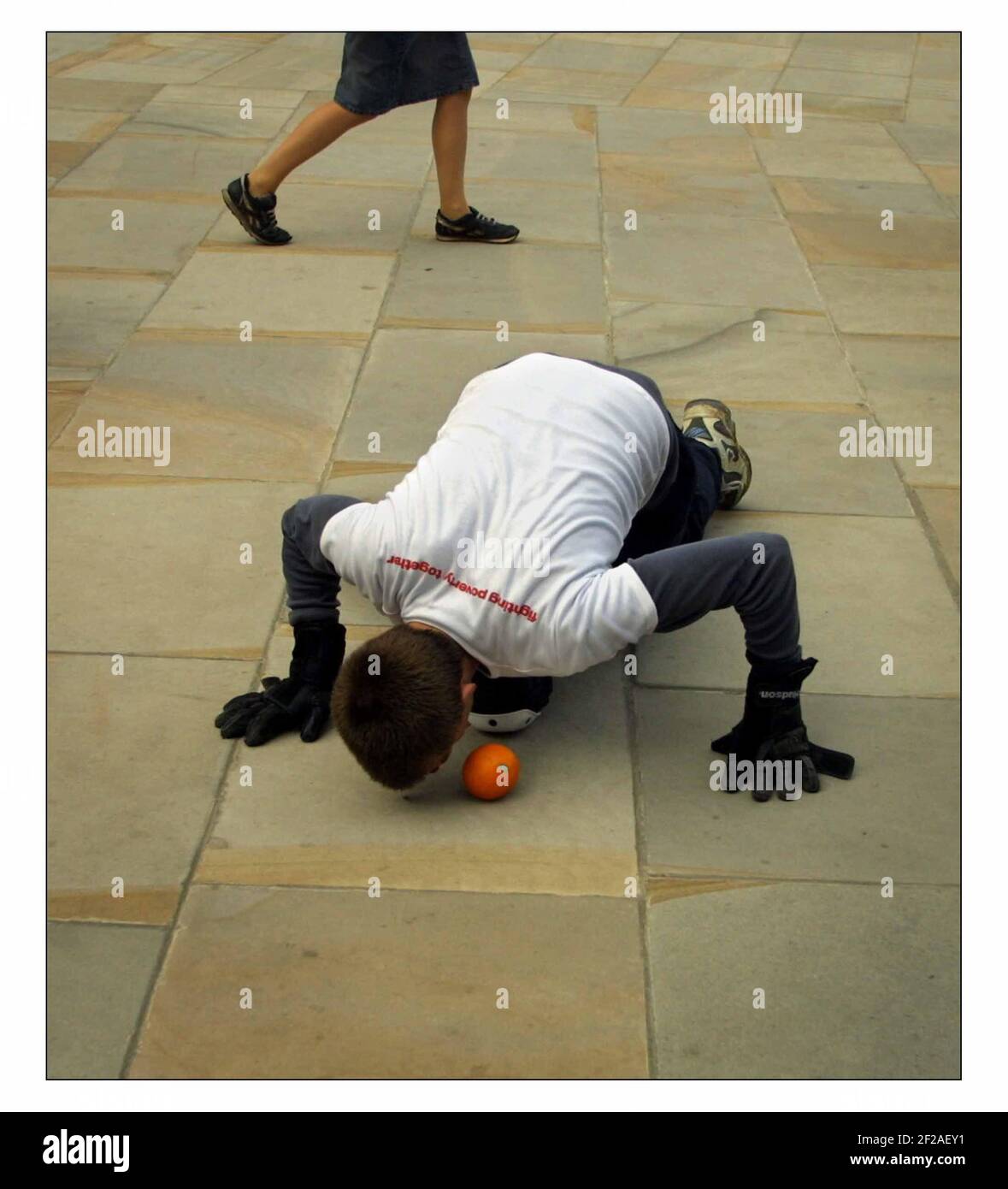 Myles Anderson rolled an orange one mile through the city of London in ...