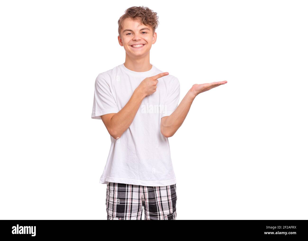Cute teen boy pointing up, gesturing idea or doing number one gesture ...