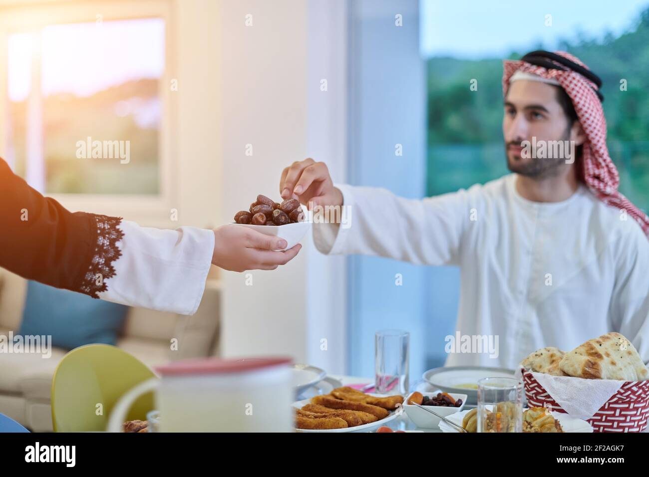 Arabic family eating with hands hi-res stock photography and images - Alamy