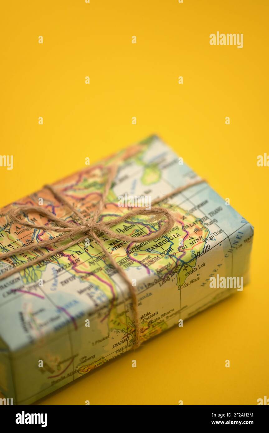 Map Paper Travel Concept with Gift Box With String Bow Stock Photo - Alamy
